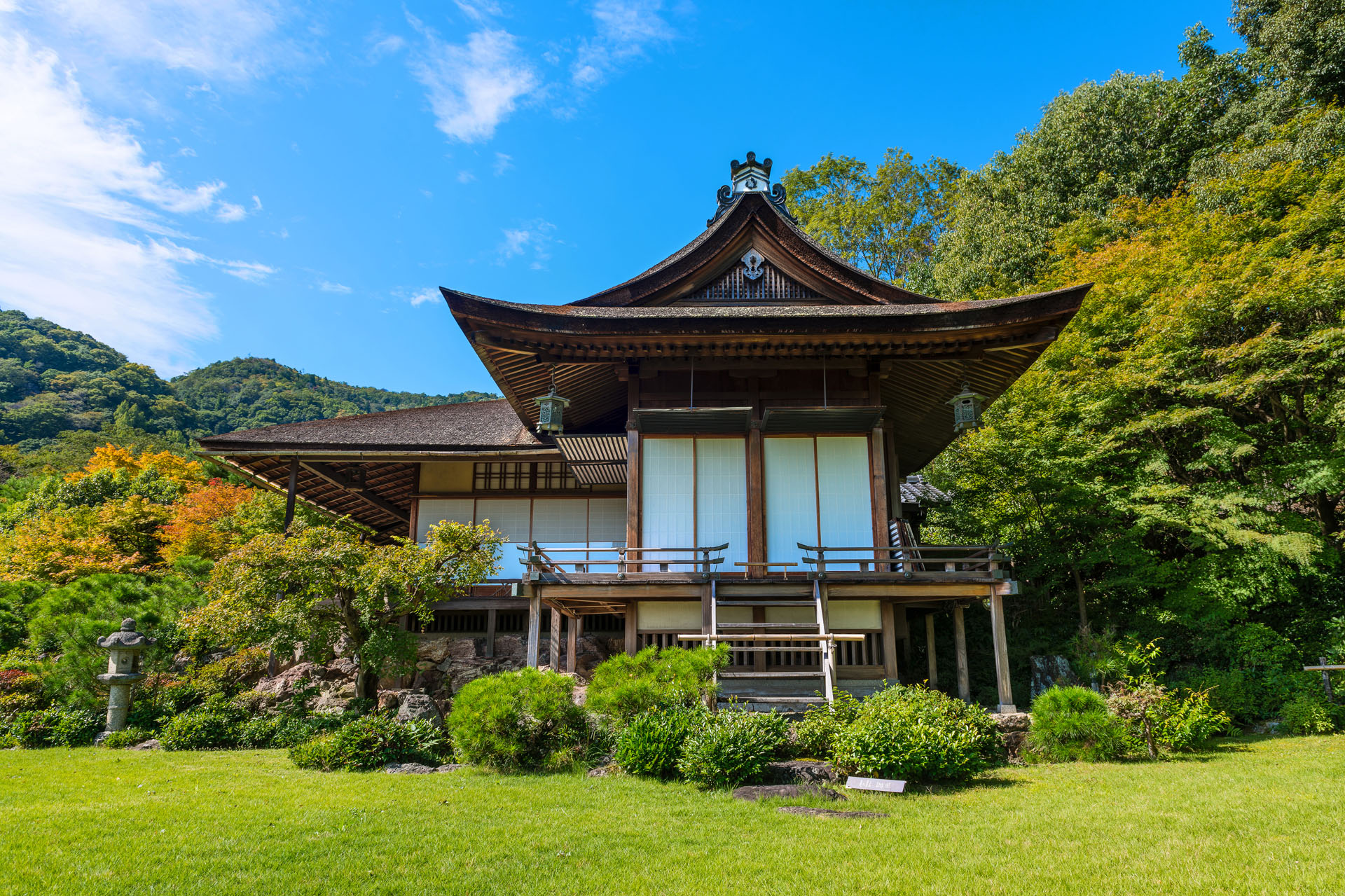 Japanese house in a forest landscape with views of trees and sky ...
